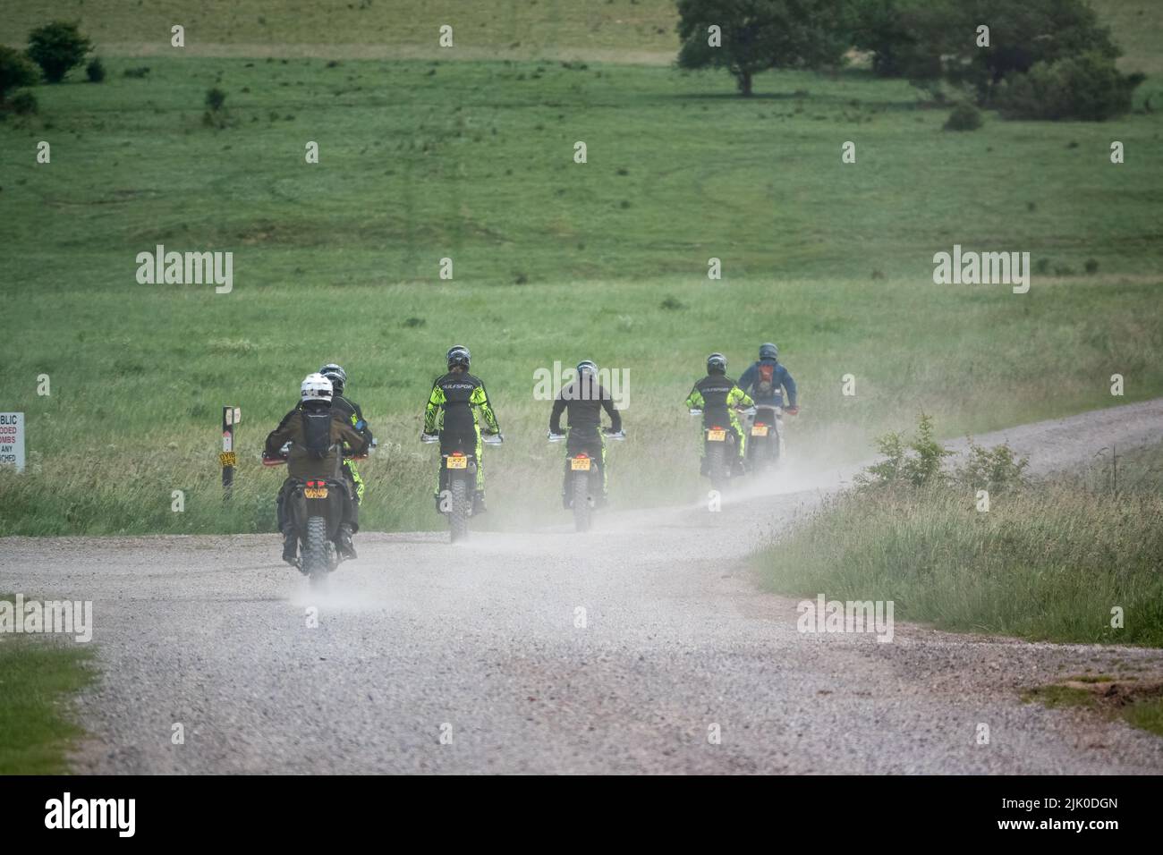 a group of motor cyclists (bikers) riding their off-road motorbikes ...