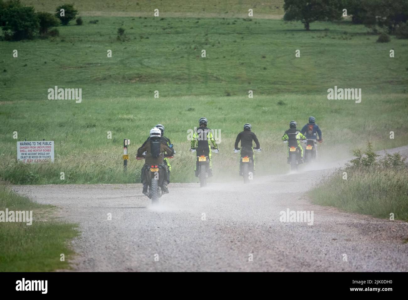 a group of motor cyclists (bikers) riding their off-road motorbikes ...