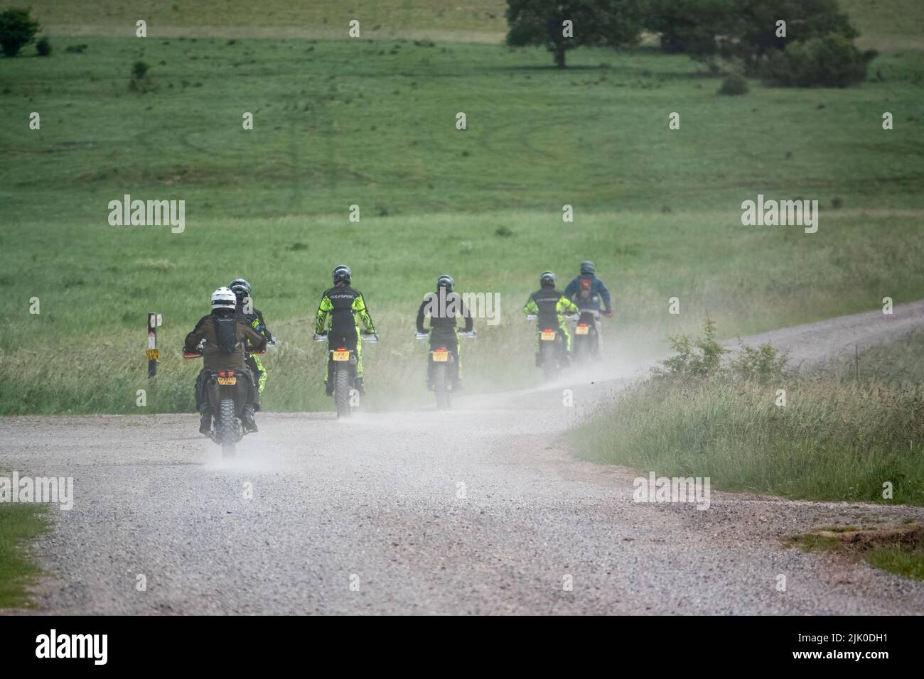 a group of motor cyclists (bikers) riding their off-road motorbikes ...