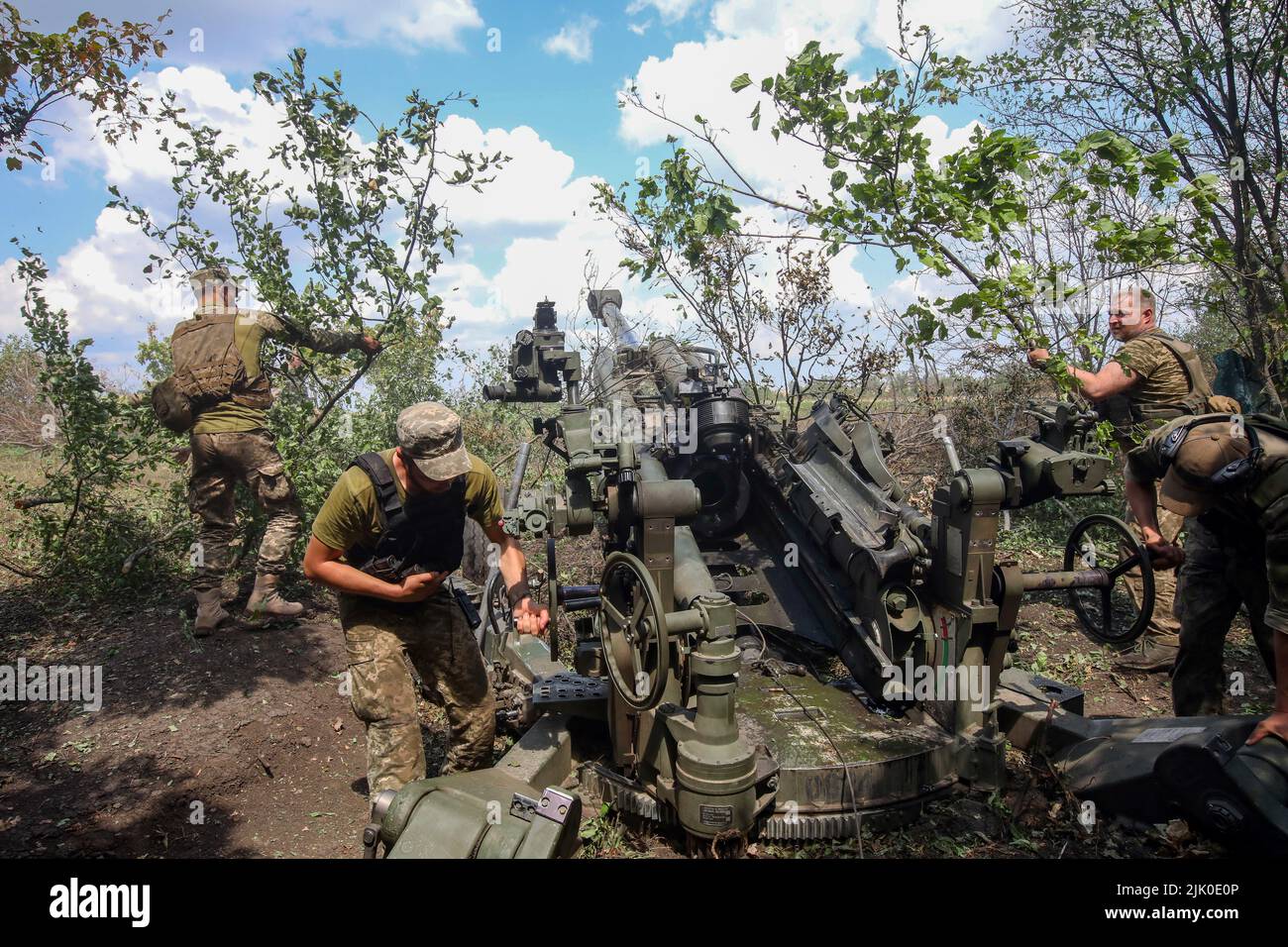 KHARKIV REGION, UKRAINE - JULY 28, 2022 - Ukrainian servicemen fire an ...