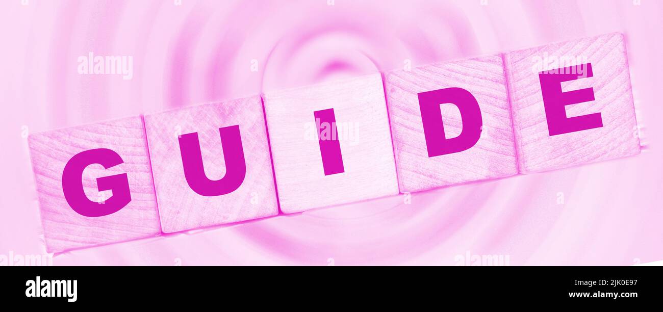 Guide Word Written In Wooden Cubes on relaxed beach landscape ...