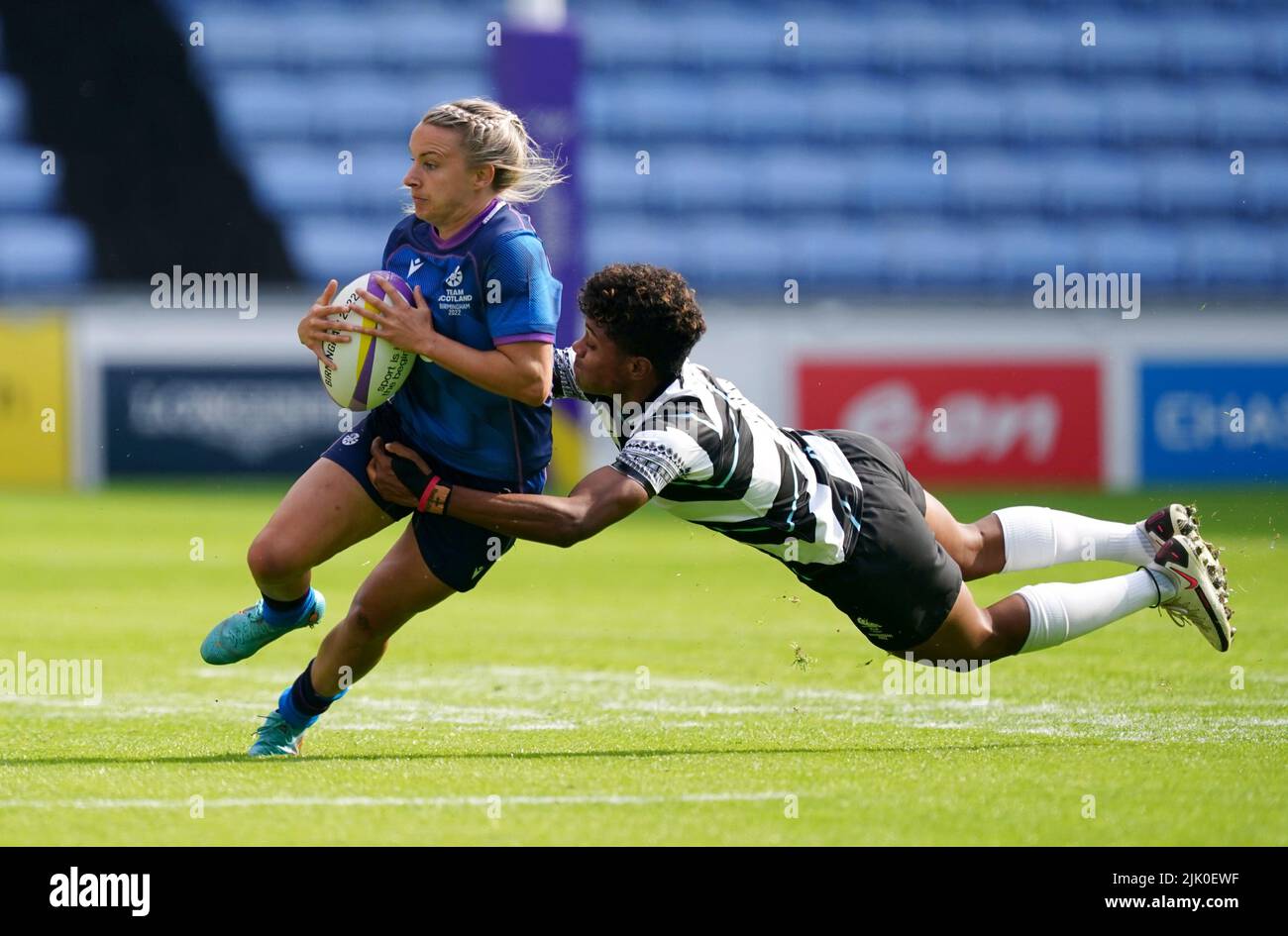 Scotland's Chloe Rollie (left) is tackled by Fiji's Sesenieli Donu ...