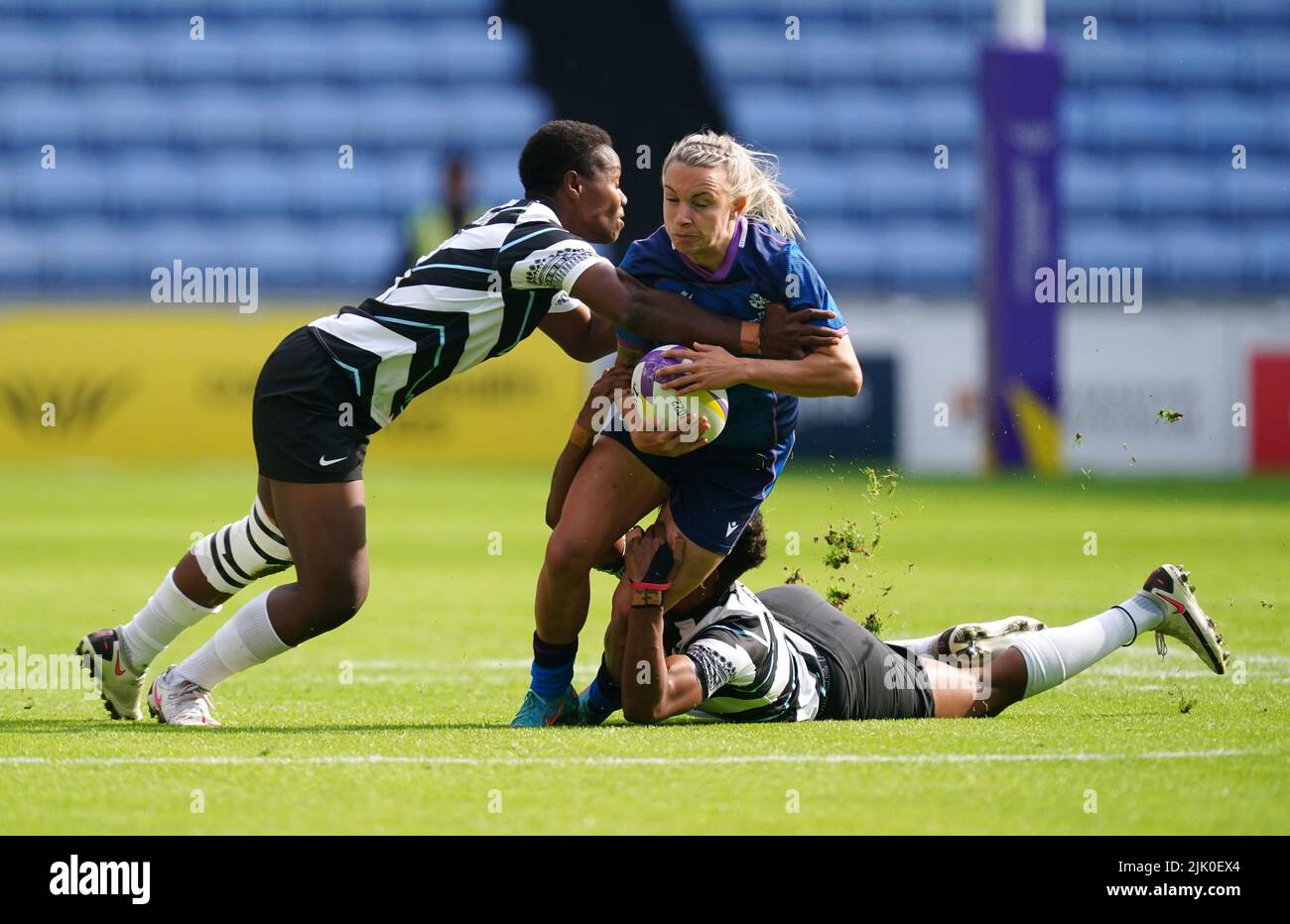 Scotland's Chloe Rollie (centre) is tackled by Fiji's Rusila Nagasau ...