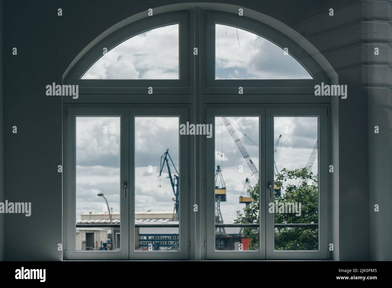 A Symmetrical view of construction through the closed window Stock ...