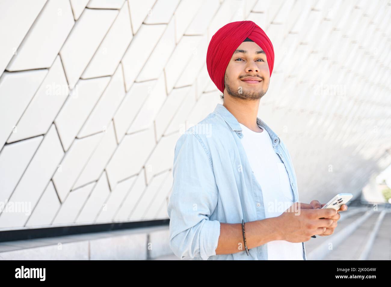 Smart inspired male Indian entrepreneur wearing red traditional ...