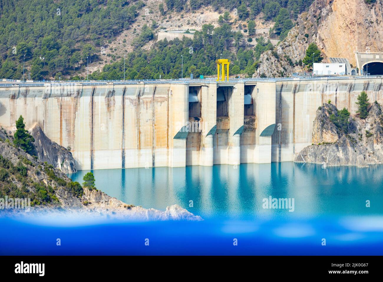 Swamp. Reservoir. Reservoir filled with blue colored water. Dam located ...