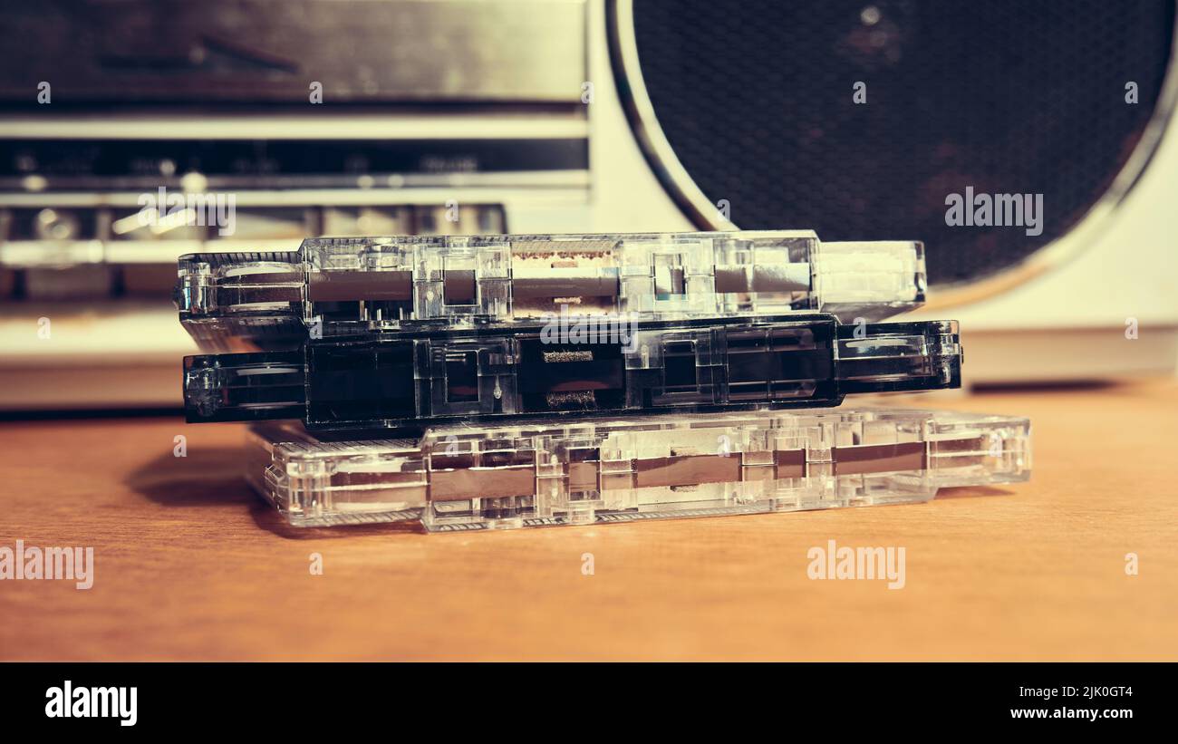 Old audio cassettes on the table close-up. Vintage compact cassettes on ...