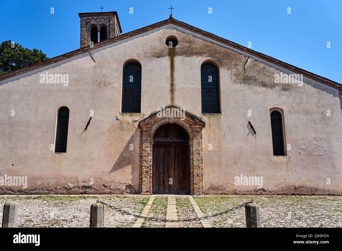 The facade and stone portal of the historic San Martino church in Este ...