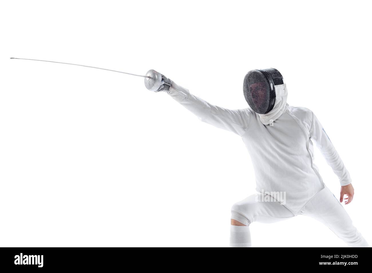 Dynamic portrait of young man, fencer in in fencing costume with sword ...