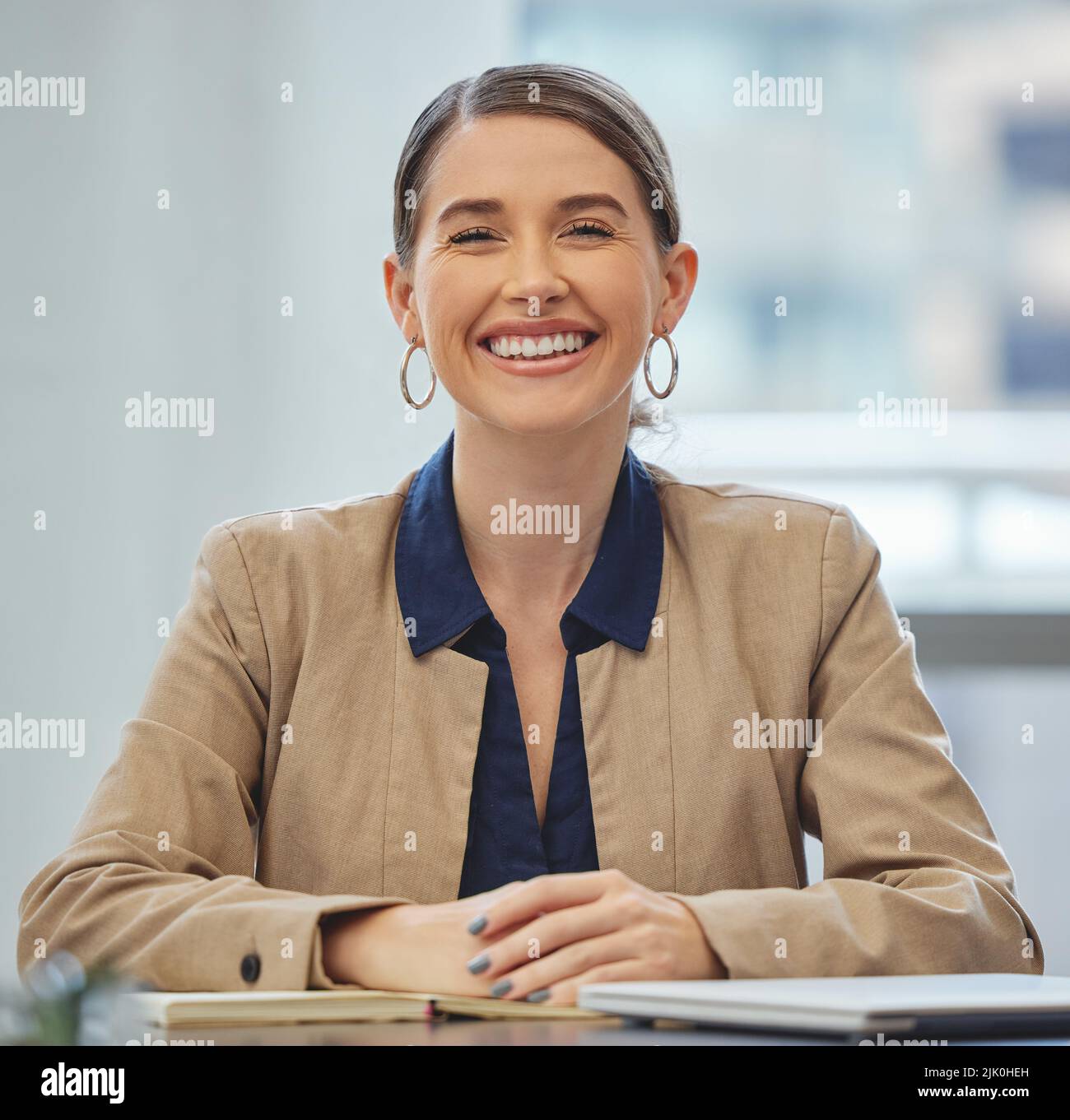 Lets make business happen. an attractive young businesswoman sitting ...