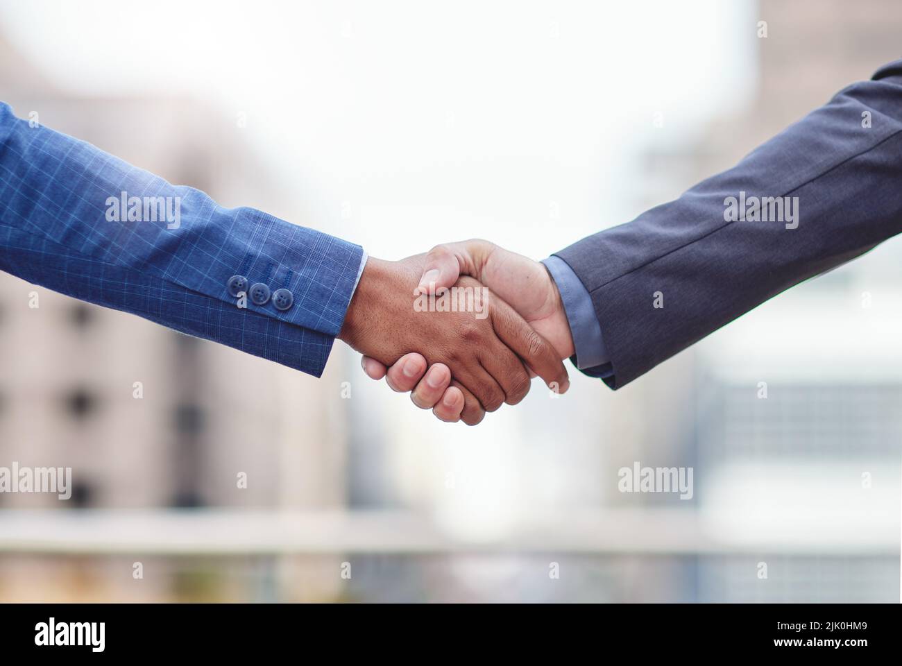 Ready for the big jump. two unrecognizable businessmen shaking hands ...