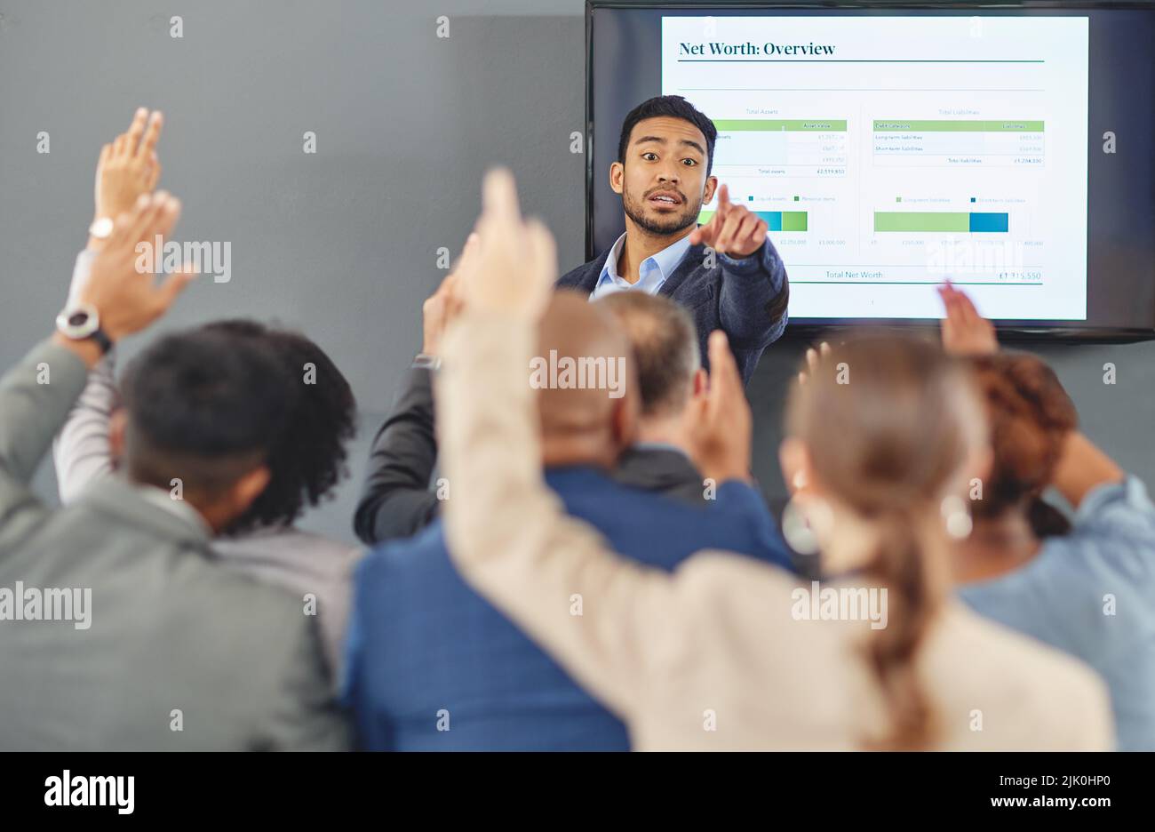 Whats your question. a group of businesspeople having a meeting in a ...