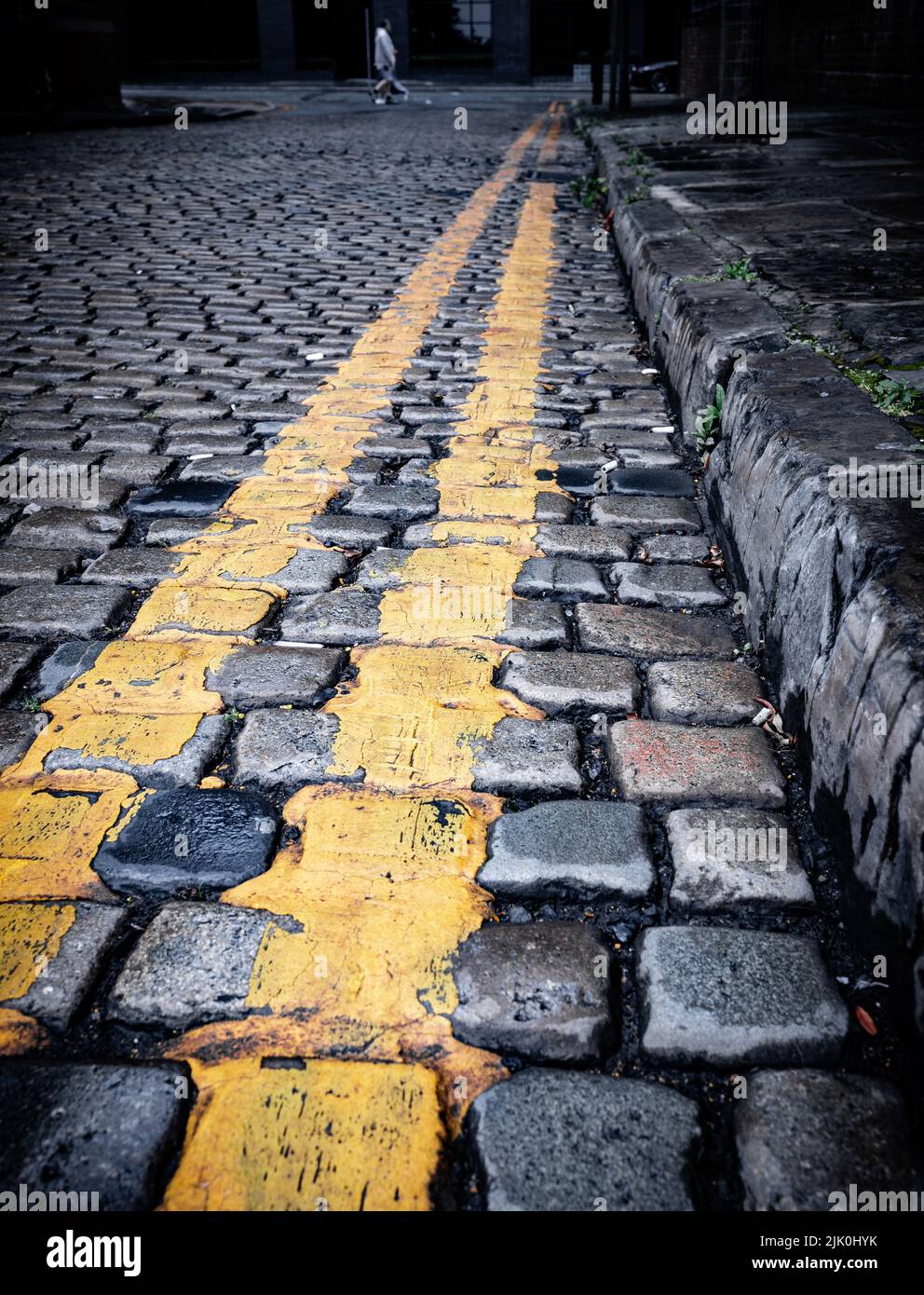 double yellow lines parking restriction painted along cobbled street ...