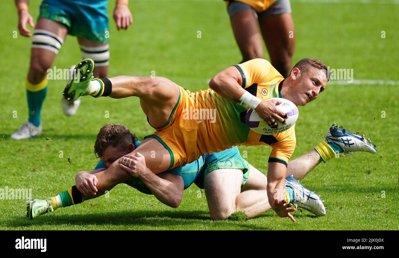 Jamaica's Gareth Stoppani (right) is tackled by Australia's Henry ...