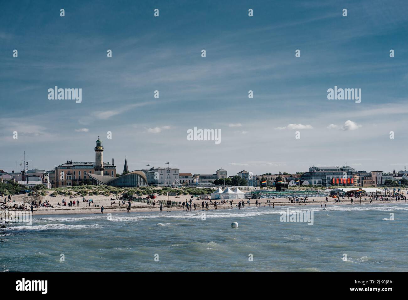 An aerial view of a lighthouse at a beautiful beach in Rostock ...