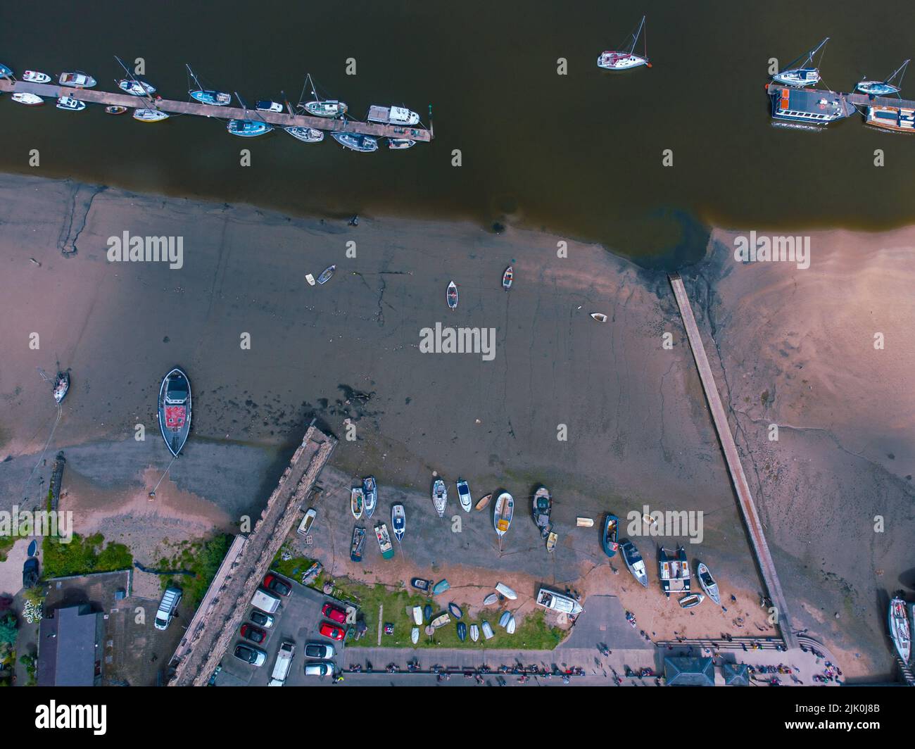 An aerial view of ships and boats anchored in a harbor during the ...