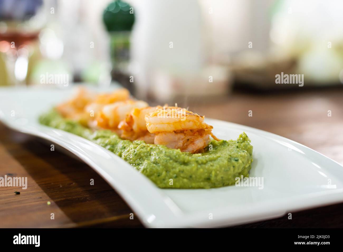 fried prawns on sweet potato puree Stock Photo - Alamy
