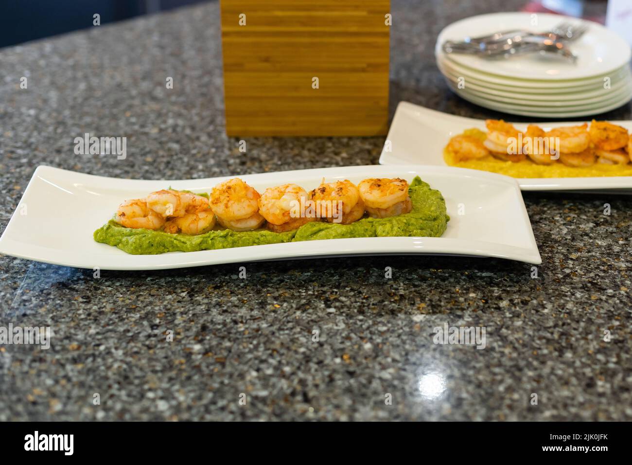 baked prawns on sweet potato puree on a platter Stock Photo - Alamy