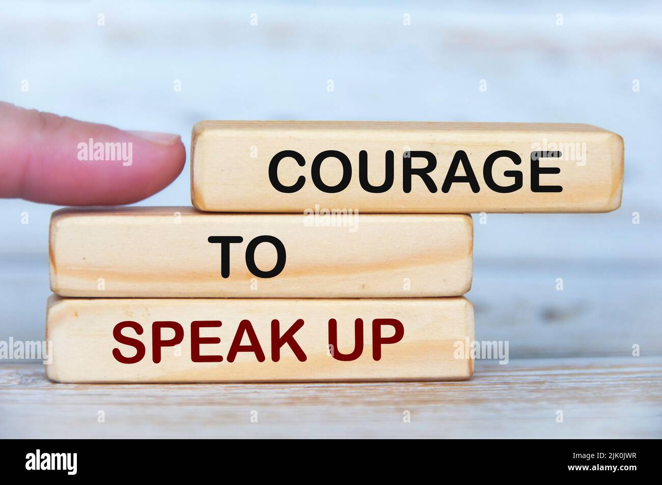 Courage to speak up text on wooden blocks. Business culture concept Stock Photo - Alamy