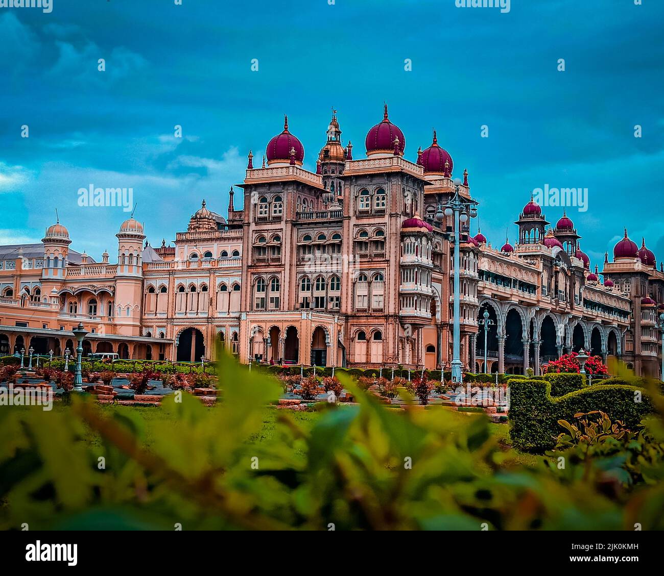 The exterior design of the beautiful Mysore Palace against cloudy sky ...