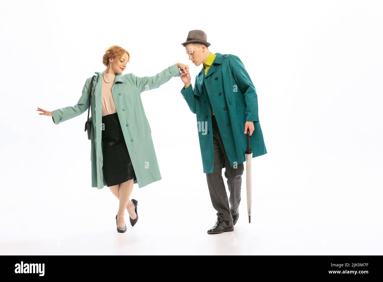 Portrait of stylish couple, man and woman in beautiful coats posing ...