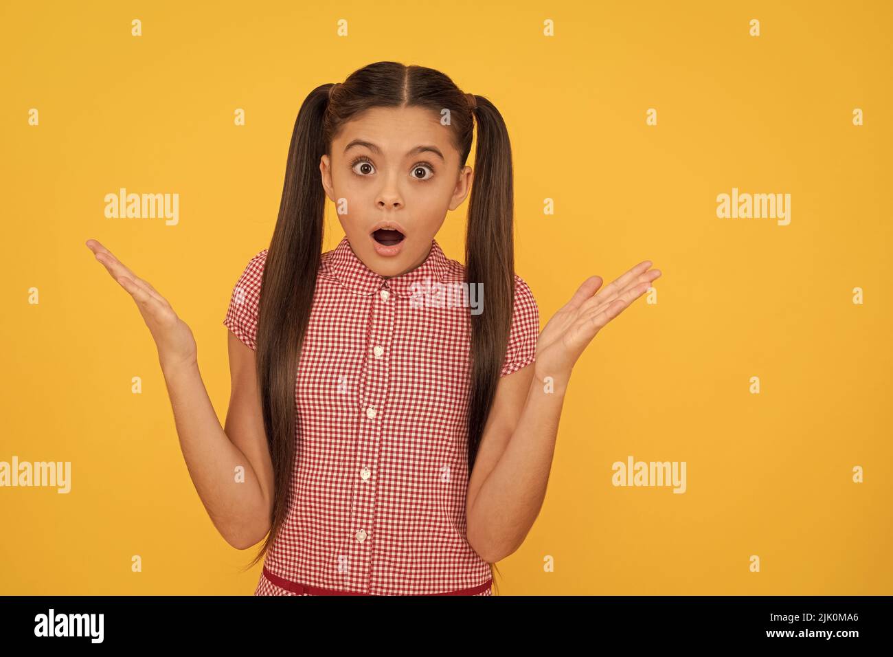 OMG. Surprised child yellow background. Wide-eyed girl got surprised ...