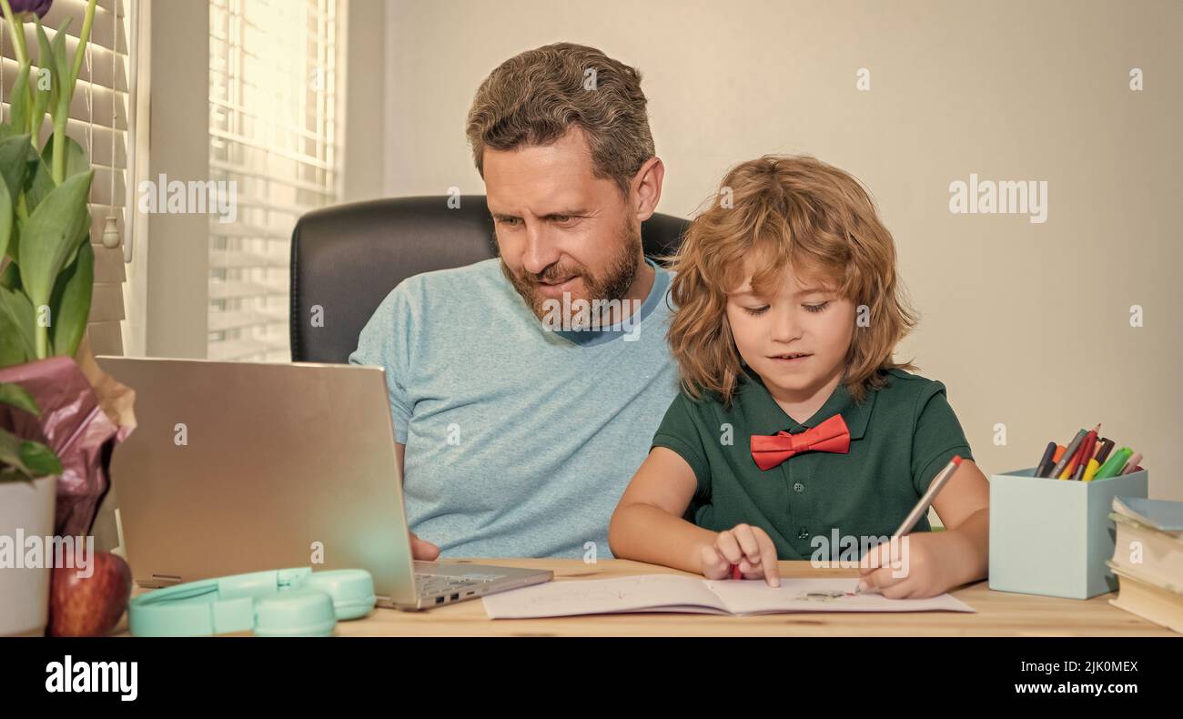 homeschooling and elearning. back to school. father and son use ...