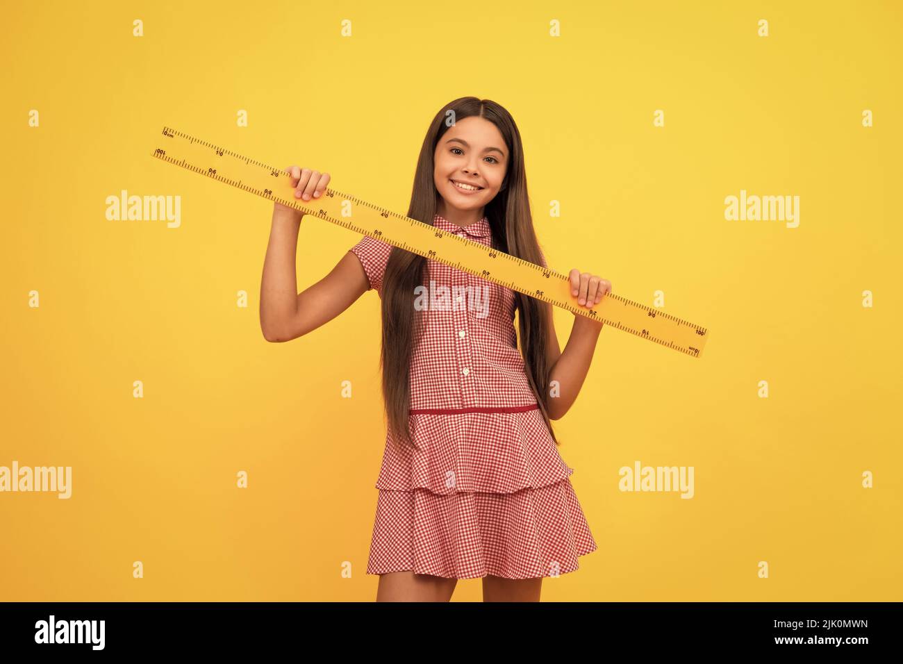 happy teen girl study math in school hold ruler, education Stock Photo ...