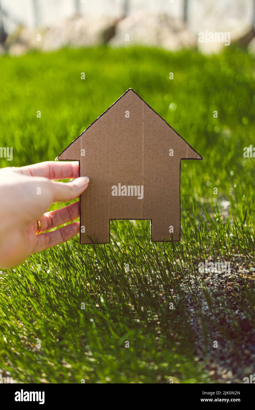 green home and construction industry, house icon on green grass lawn ...