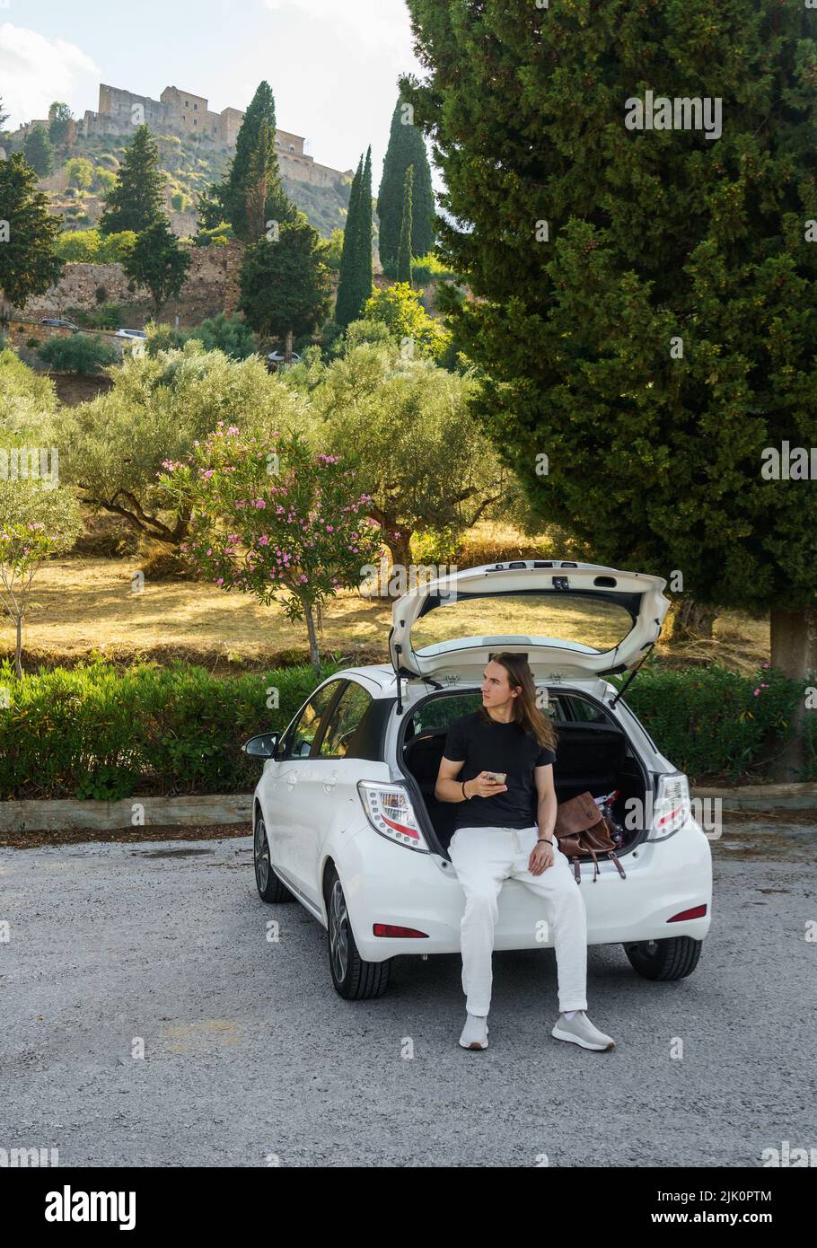 Man on road trip Stock Photo - Alamy