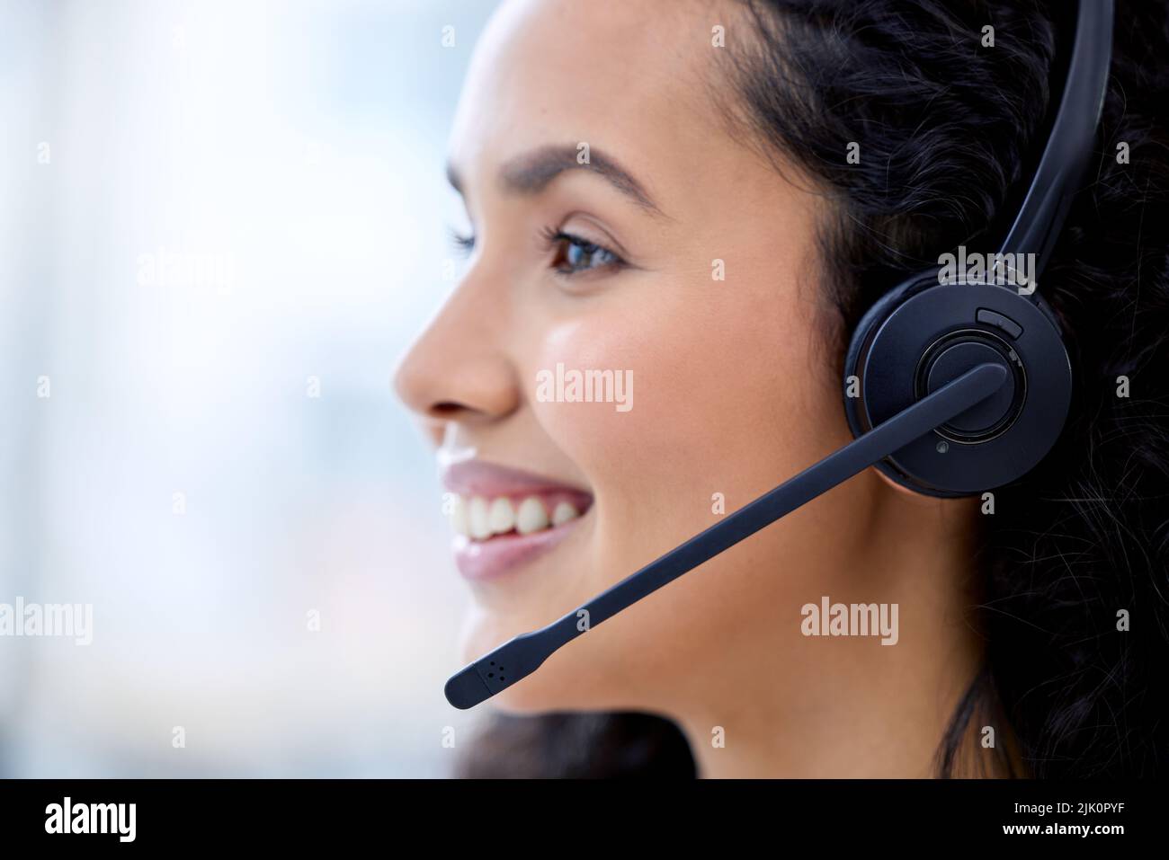 Friendliness resonates through phone calls. an attractive young call ...