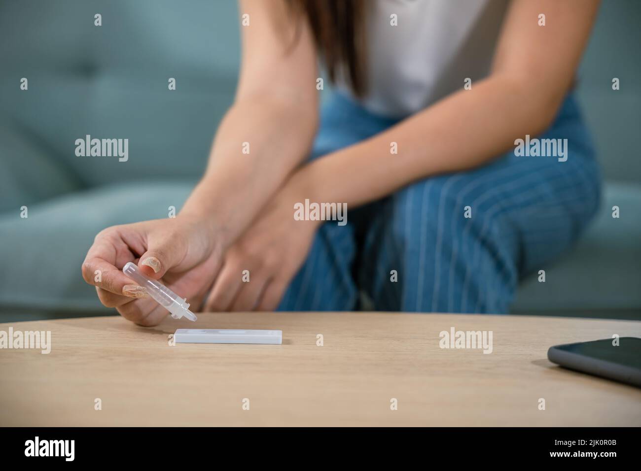 Close up woman hands using rapid antigen test kit for selftest, female ...
