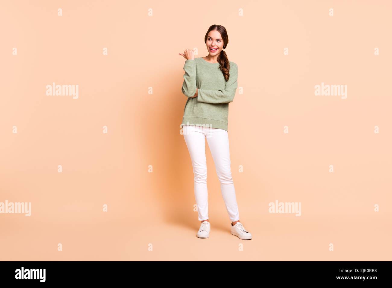 Full length photo of dreamy pretty lady wear green sweater pointing ...