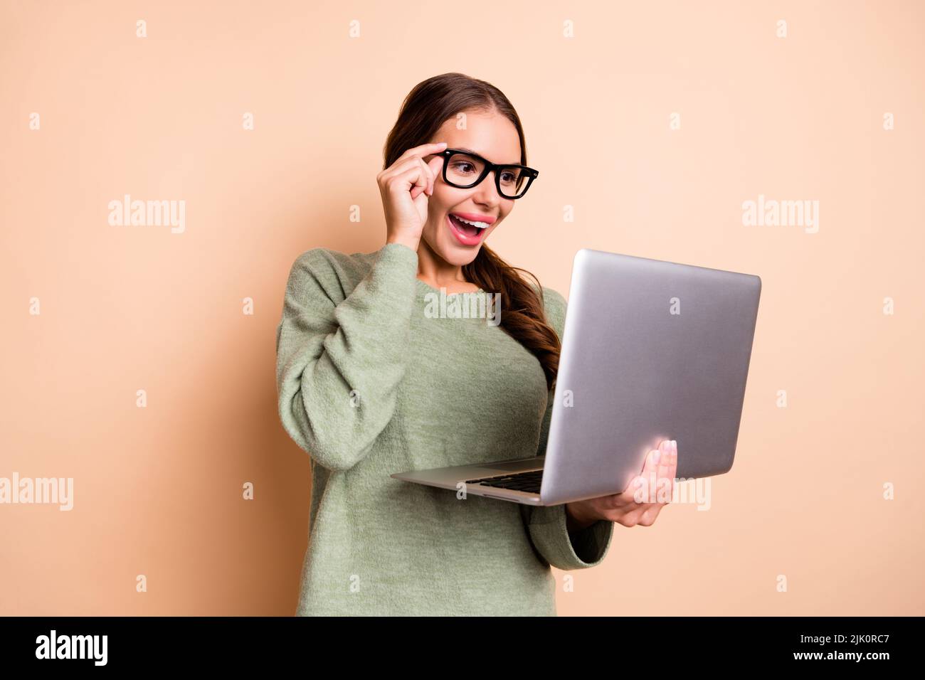 Photo of positive excited lady wear green sweater spectacles reading ...