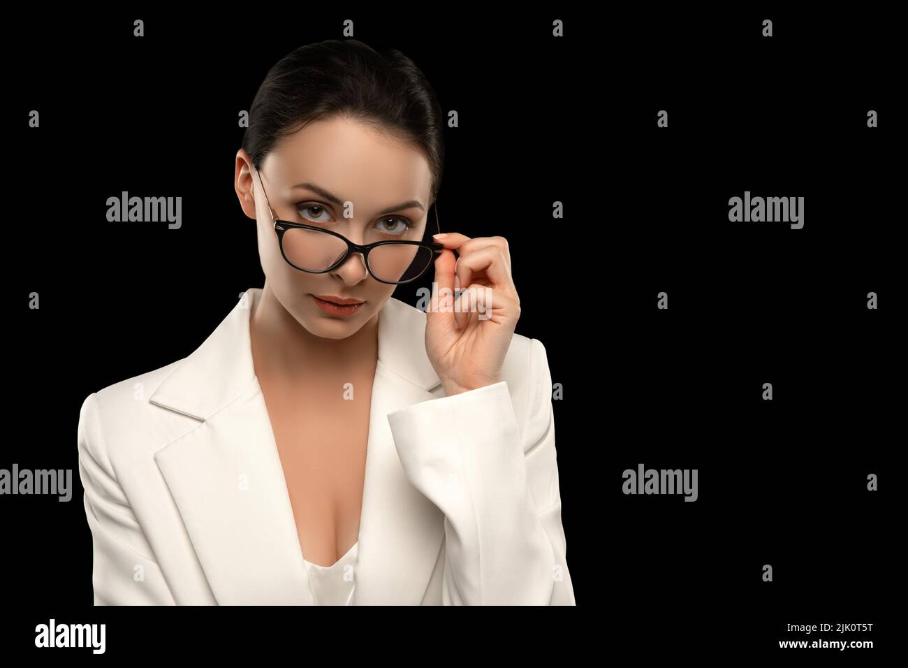 Lady boss. Successful Caucasian woman in glasses and white suit as a ...