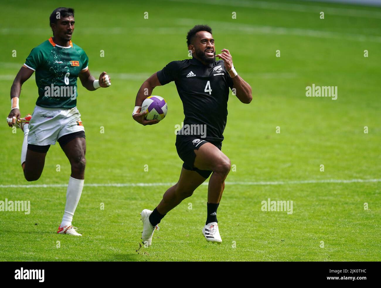 New Zealand's Akuila Rokolisoa breaks free to score a try during the ...