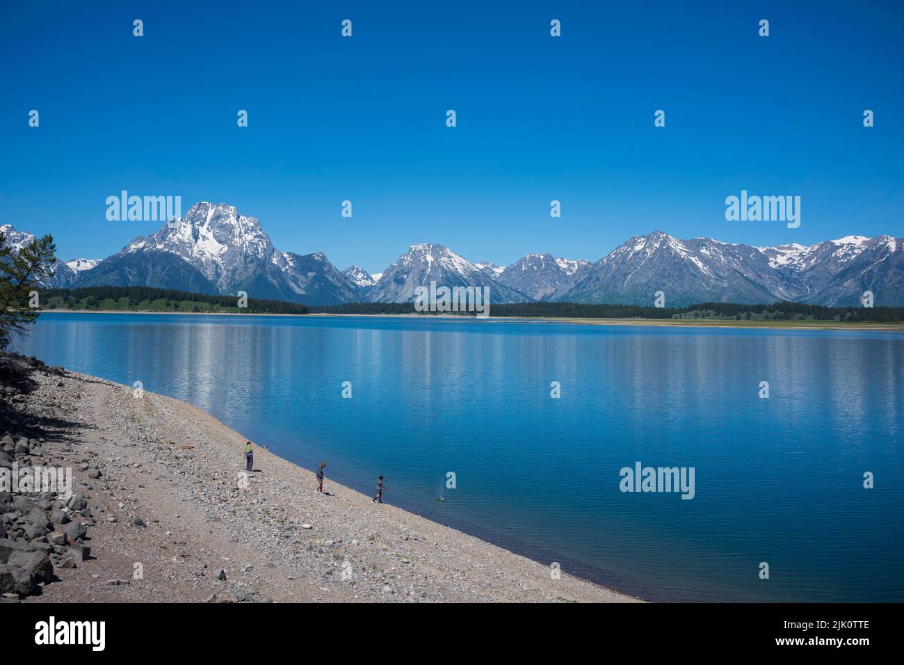 Jackson, WY, USA - Jun 27, 2022: A child throws a stone into Jackson ...