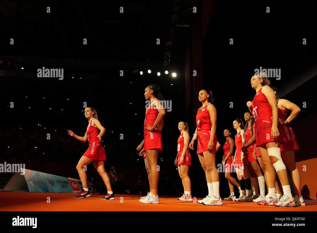 England’s Natalie Metcalf leads her side out before the Pool B Netball ...