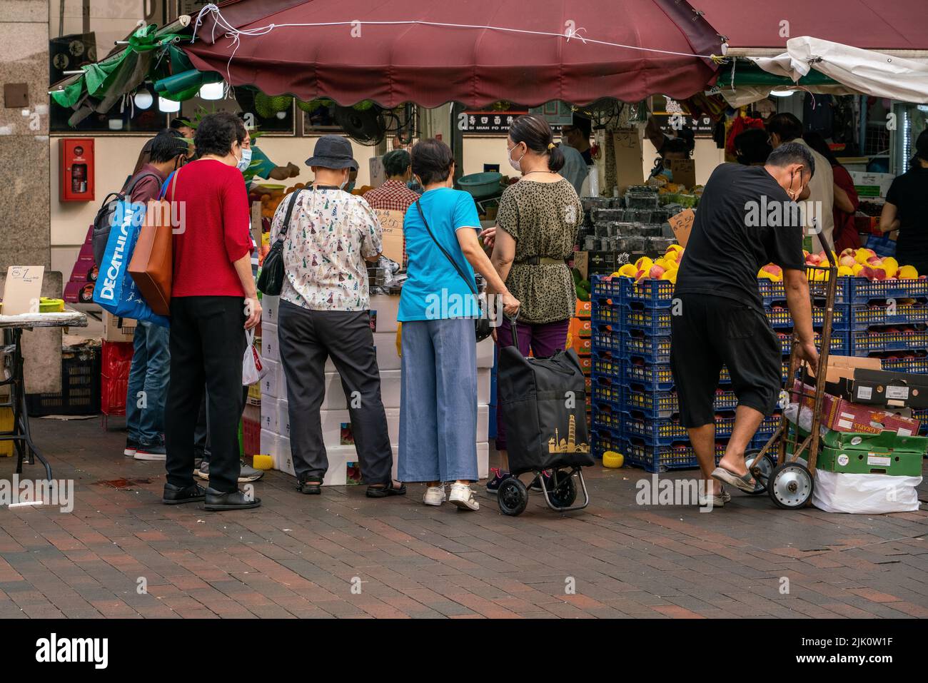 group of shoppers buying fruit at good prices outside Fu Lu Shou ... group of shoppers buying fruit at good prices outside Fu Lu Shou ...