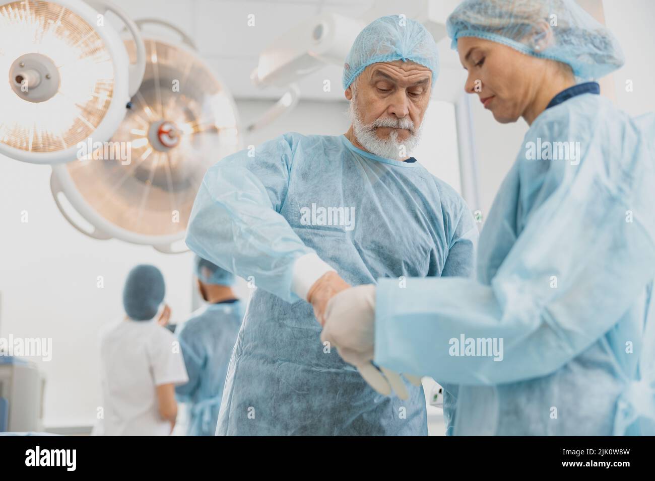 Team of surgeons in the operating room preparing for surgery Stock ...
