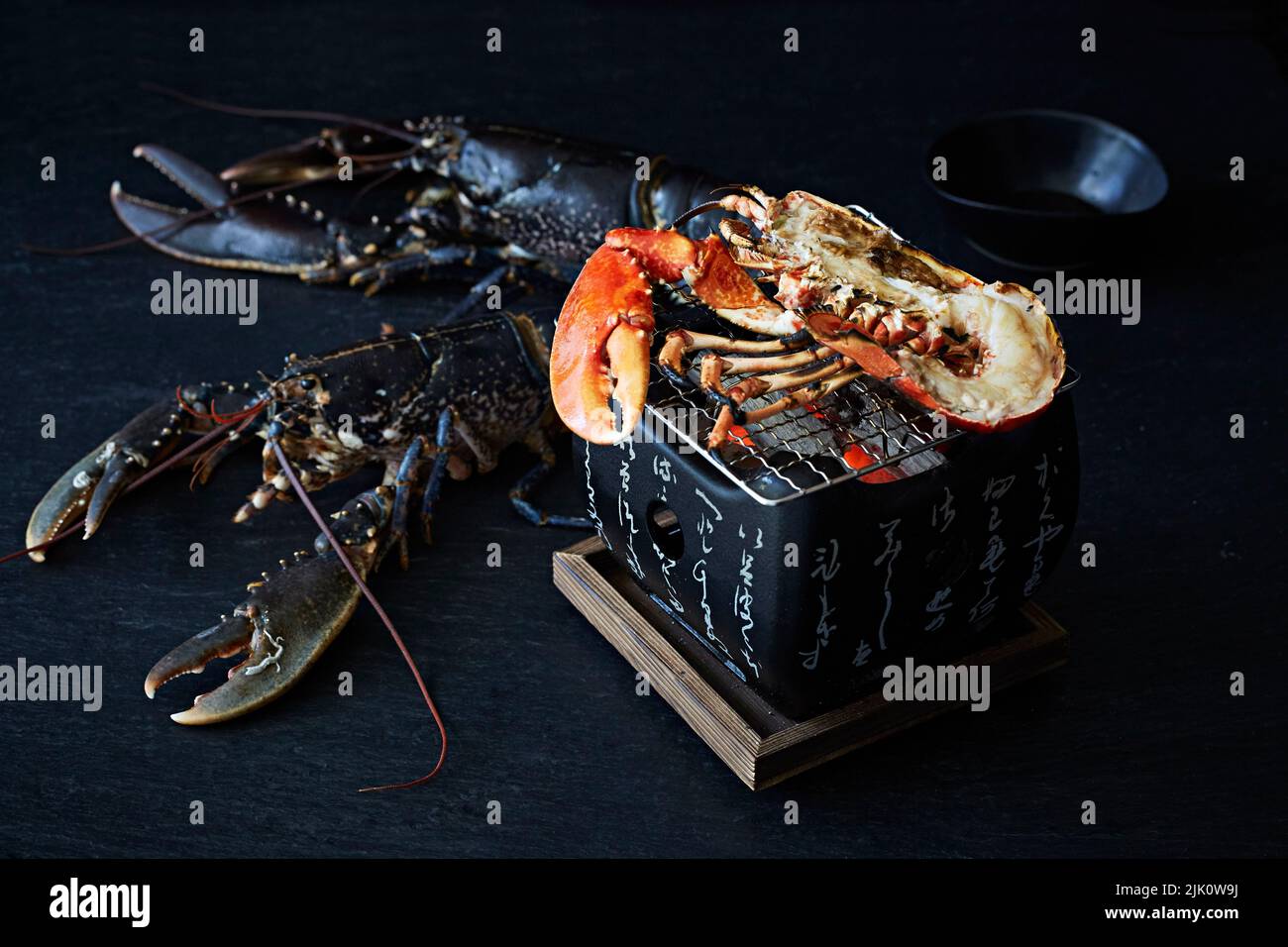 Dressed lobster on a japanese barbecue Stock Photo - Alamy