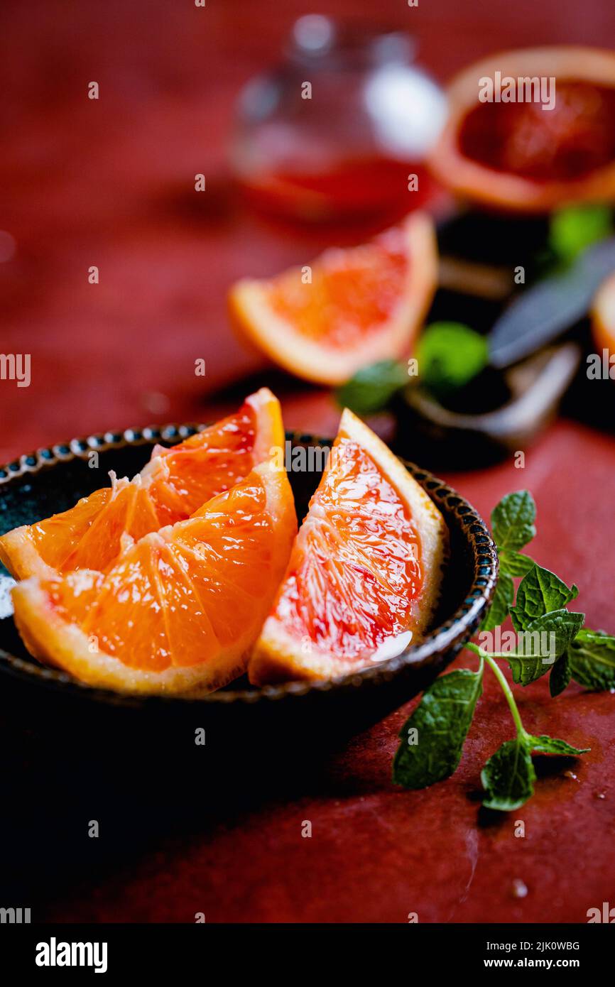 Sicilian blood orange slices in a bowl Stock Photo - Alamy