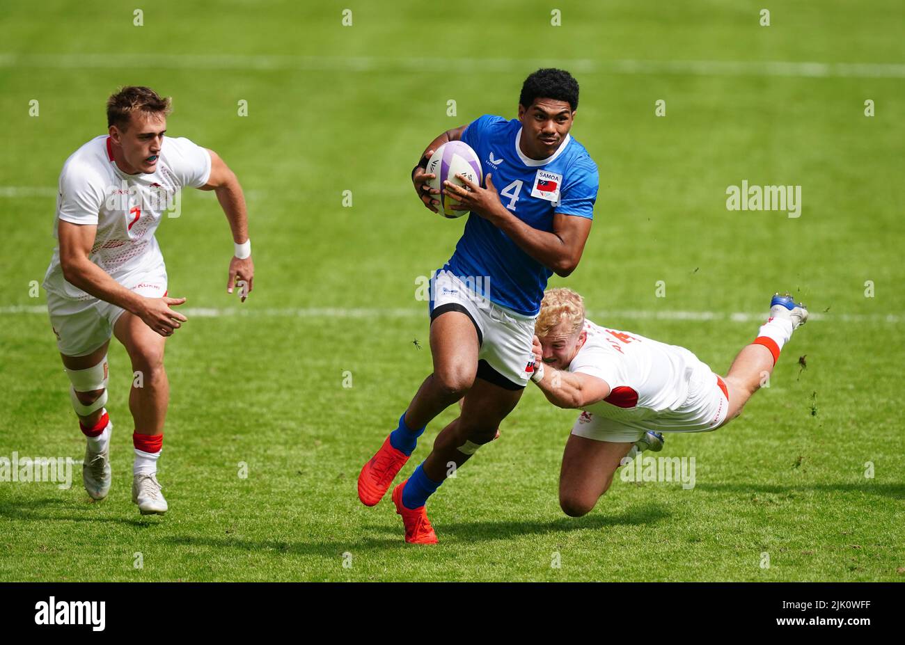 Samoa's Motu Opetai gets away from England's Jamie Adamson during the ...