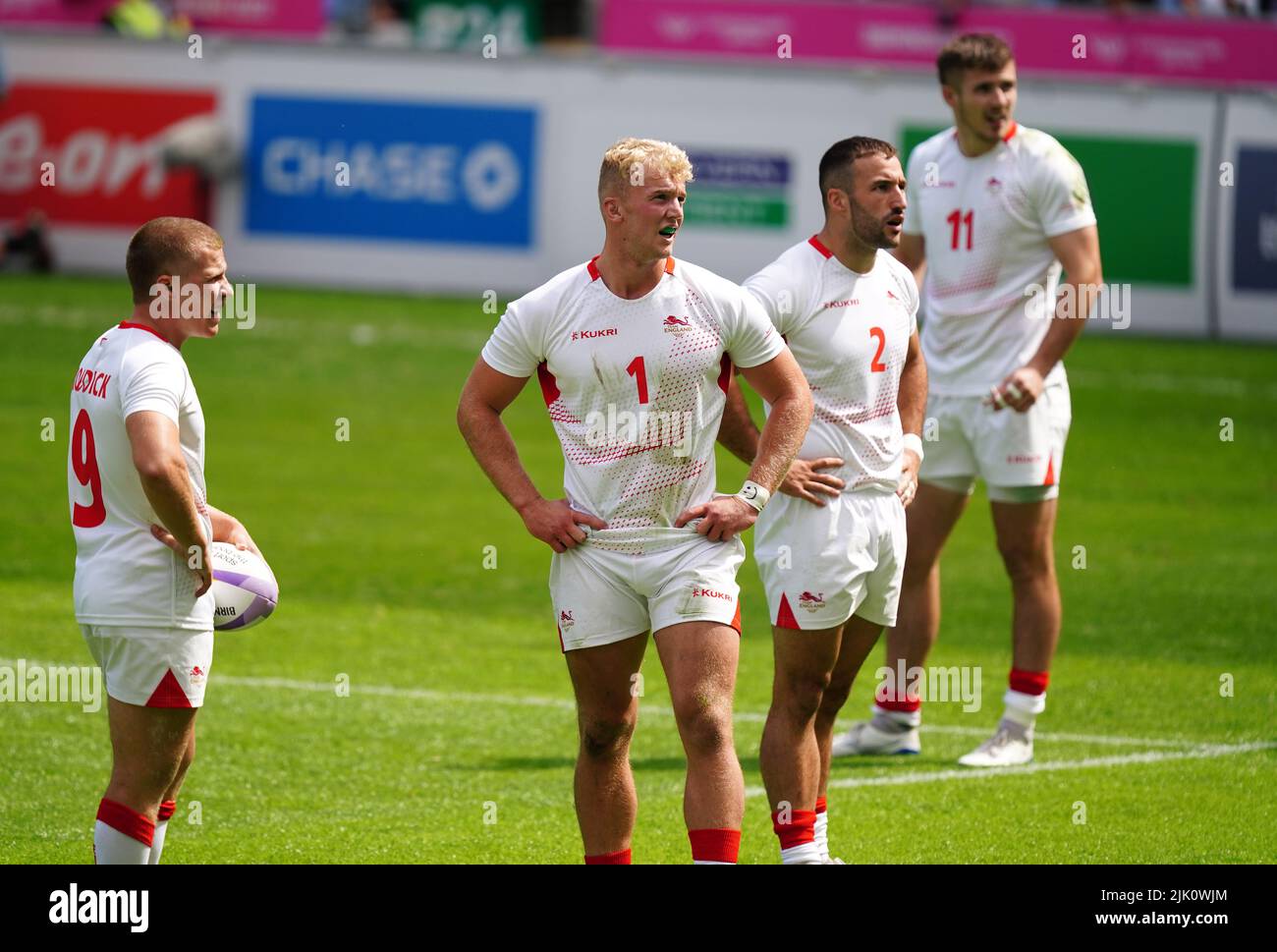 England's Jamie Adamson (centre) and team-mates stand dejected during ...