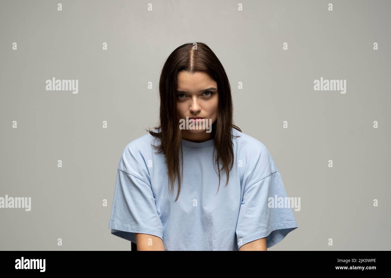 Negative human emotions and feelings. Grumpy young woman posing ...