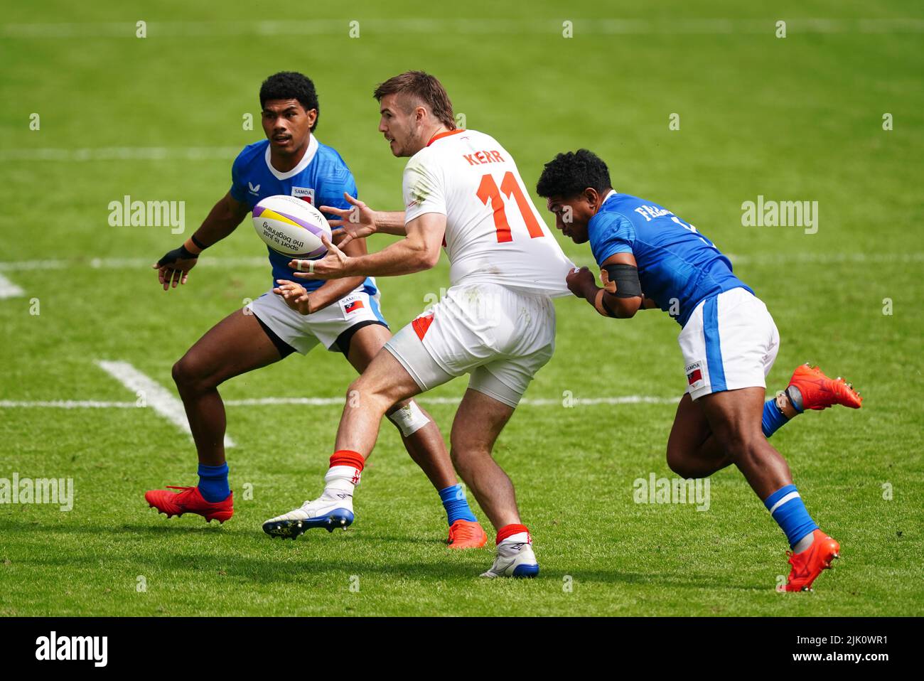 England's Charlton Kerr is tackled by Samoa's Faafoi Falaniko (right ...