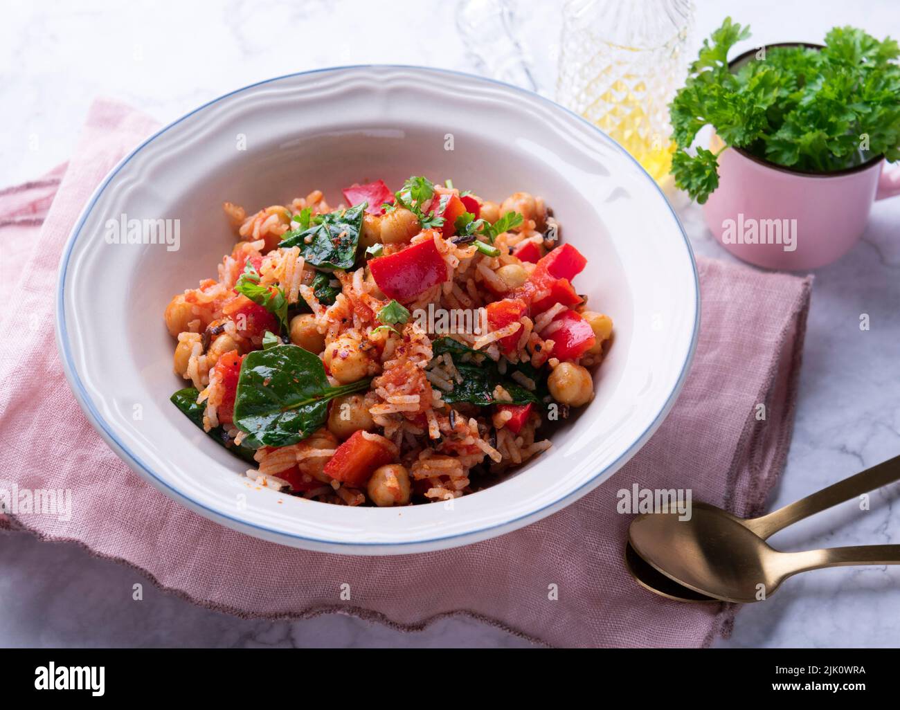 Vegan vegetable fried rice with chickpeas and spinach Stock Photo - Alamy