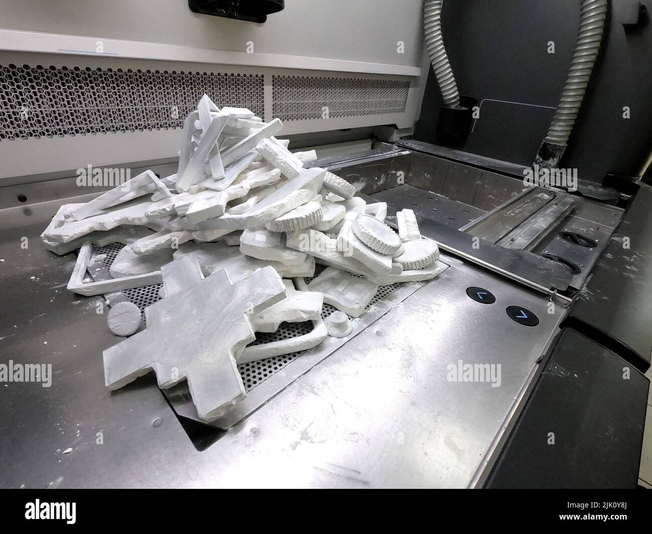 Objects and models printed on industrial 3D printer from white plastic ...
