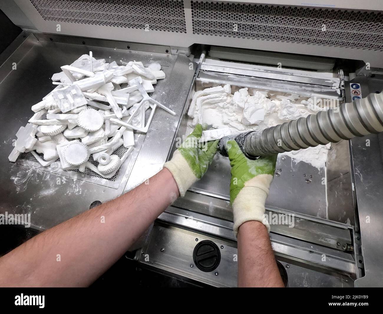 Engineer or artist designer printing 3D parts and shaping models from ...