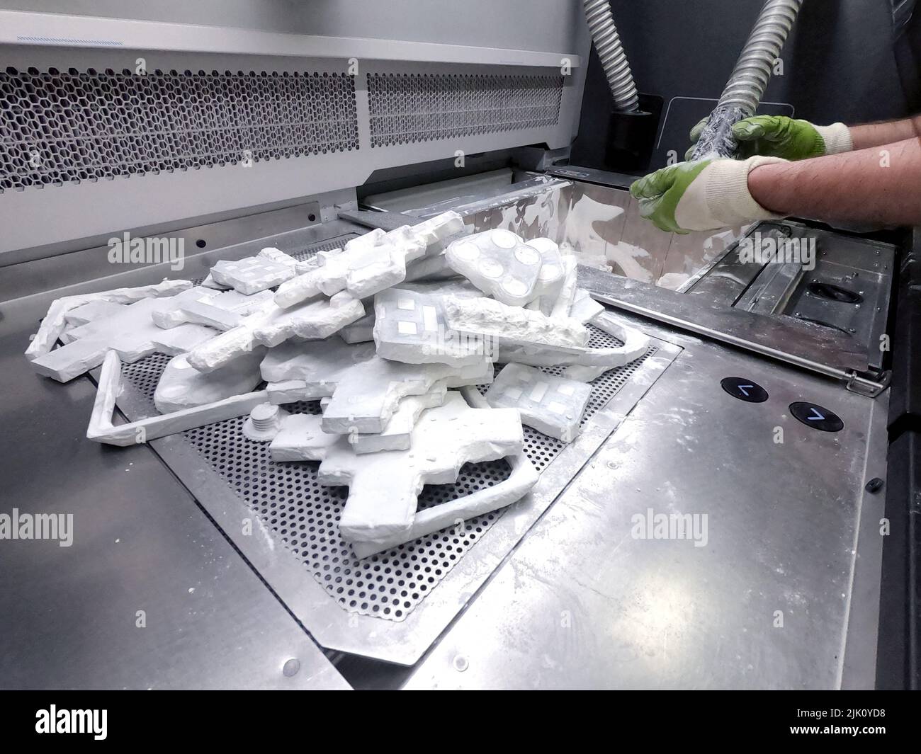 Engineer or artist designer printing 3D parts and shaping models from ...